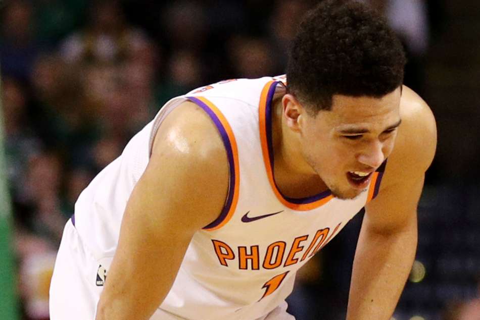 Suns PG Booker leaves loss to Rockets late with suspected injury - myKhel